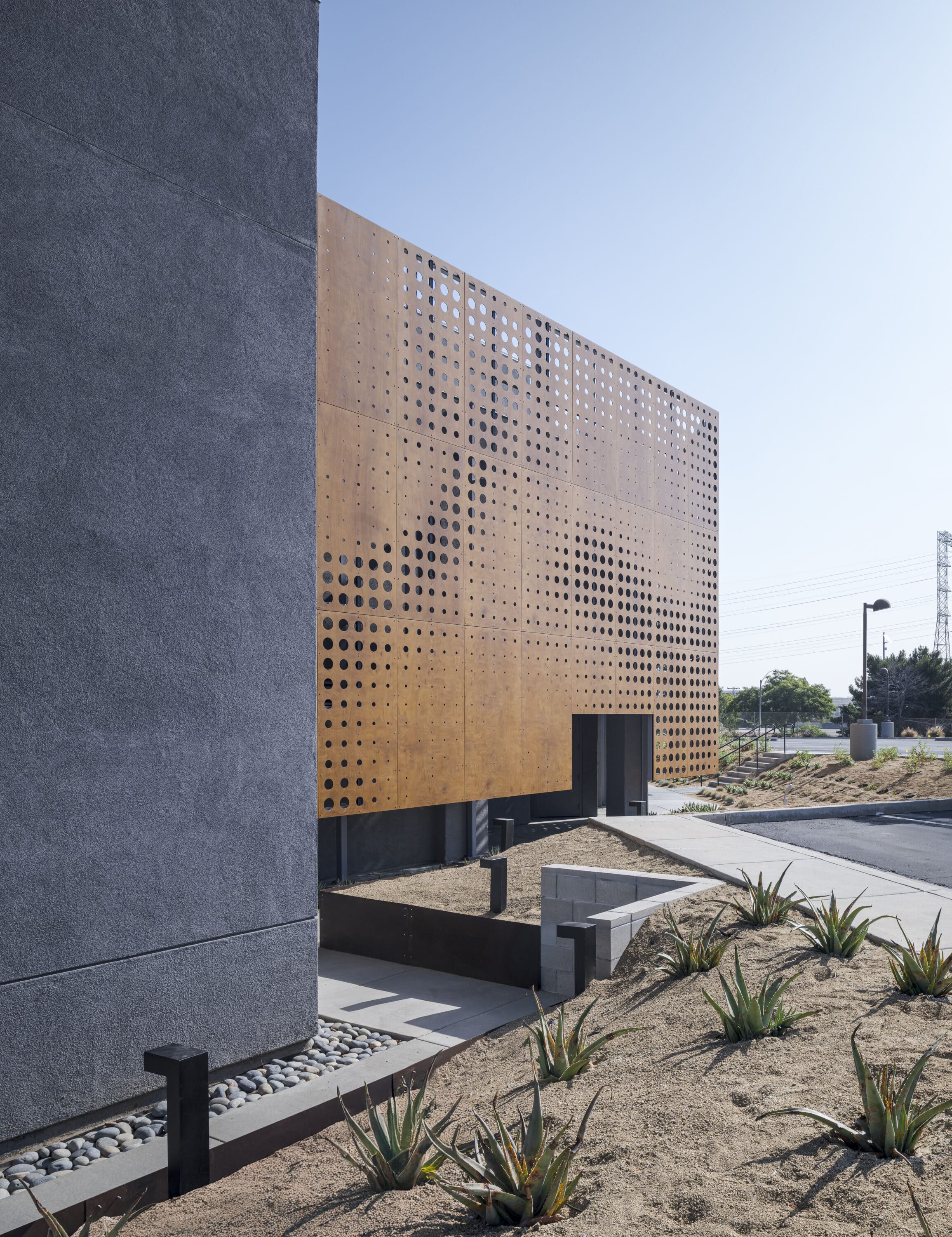 Perforated wood facade in Sessions by the Bay — Parklex Prodema